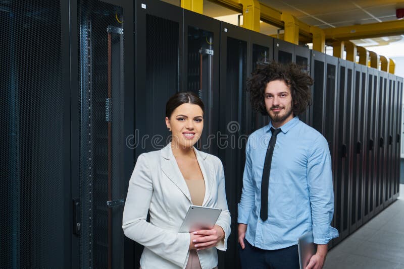 Young Couple Working at a Data Center Stock Photo - Image of ...