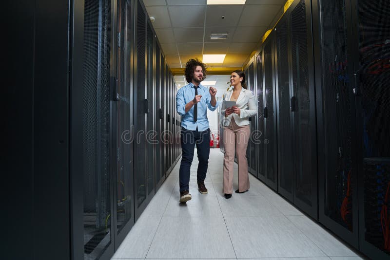 Young Couple Working at a Data Center Stock Image - Image of cable ...
