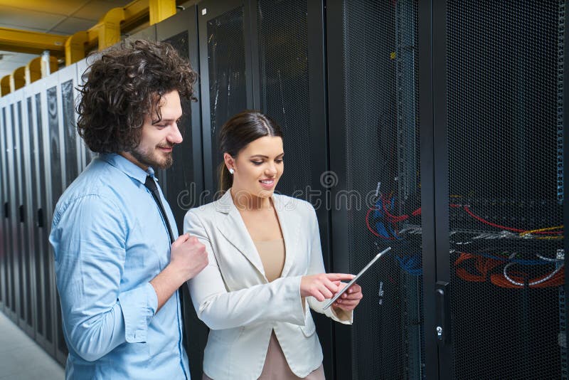 Young Couple Working at a Data Center Stock Image - Image of fixing ...