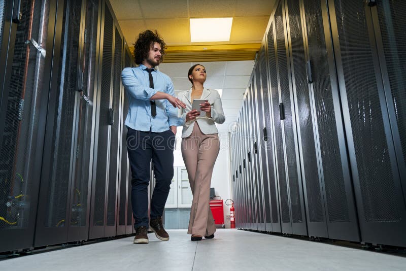 Young Couple Working at a Data Center Stock Photo - Image of couple ...