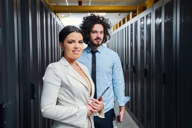 Young Couple Working at a Data Center Stock Photo - Image of adjusting ...