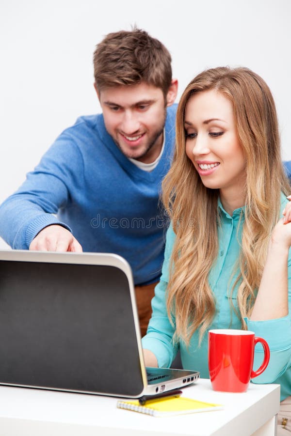Young Couple Working with Laptop Stock Image - Image of explain, house ...