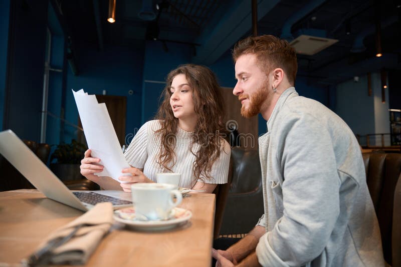 Young Couple Working Papers Laptop Restaurant Stock Photos - Free ...