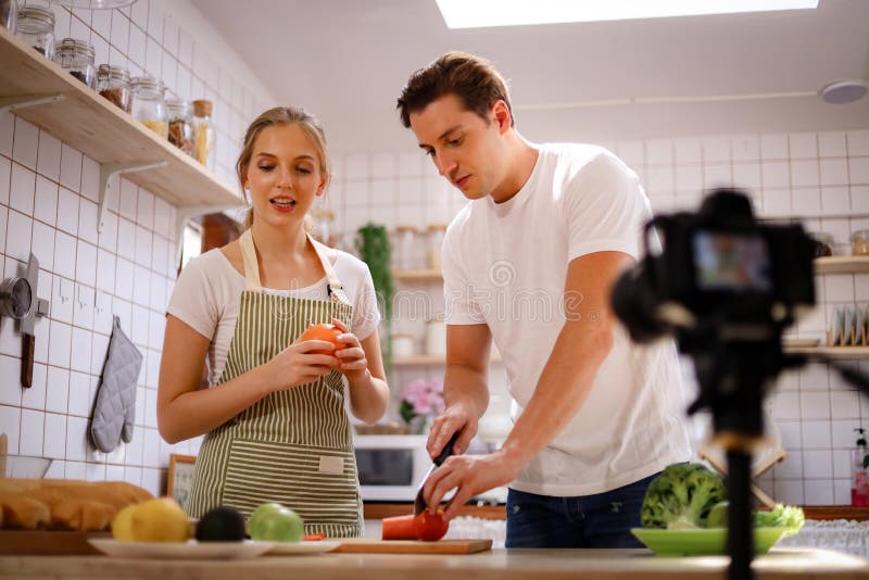Young Couples are Enjoying Cooking at the Kitchen in Working from Home ...