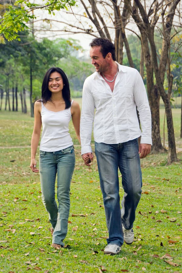Young Couples Walk Hand in Hand Stock Photo - Image of love, couple ...