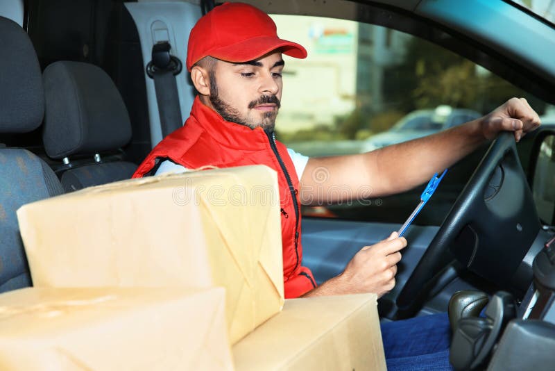 Young Courier Checking Amount of Parcels Stock Image - Image of package ...