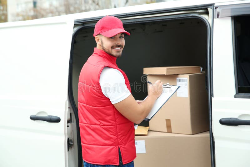 Young Courier Checking Amount of Parcels in Delivery Van Stock Image ...
