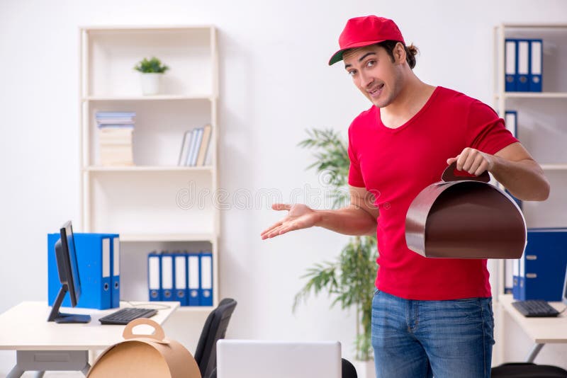 Young Male Courier Delivering Cake To the Office Stock Image - Image of ...