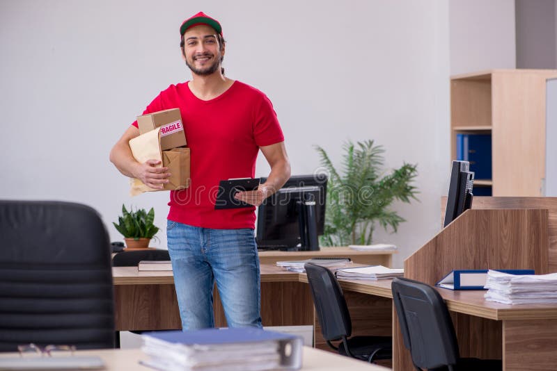 Young Male Courier Delivering Post To the Office Stock Image - Image of ...