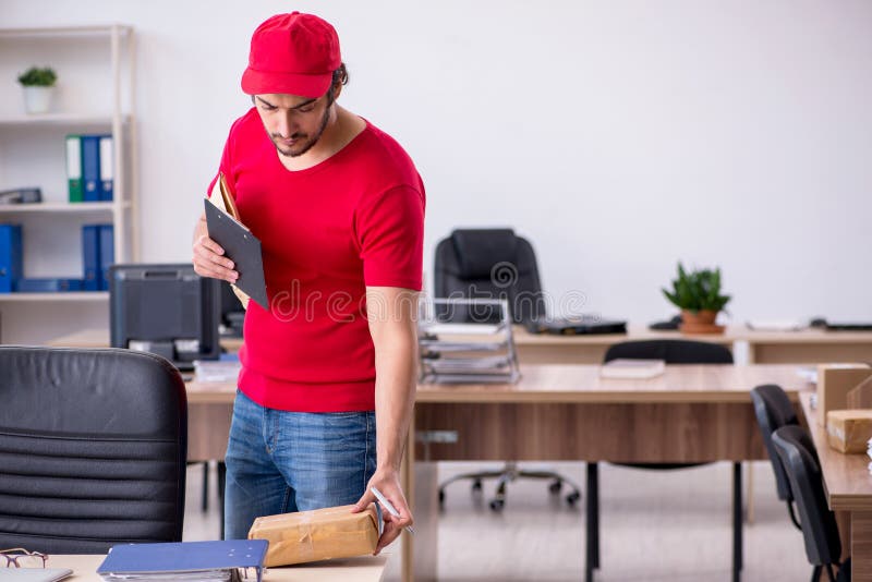 Young Male Courier Delivering Post To the Office Stock Photo - Image of ...