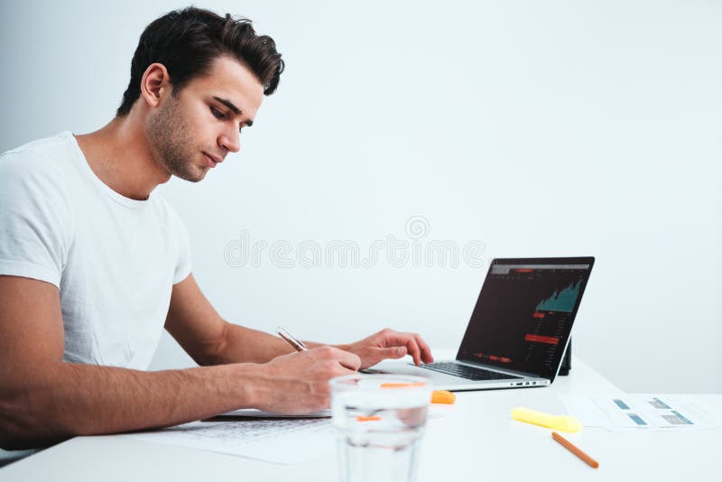 Young Coworker Man Working at Work Place Loft while Sitting at the ...