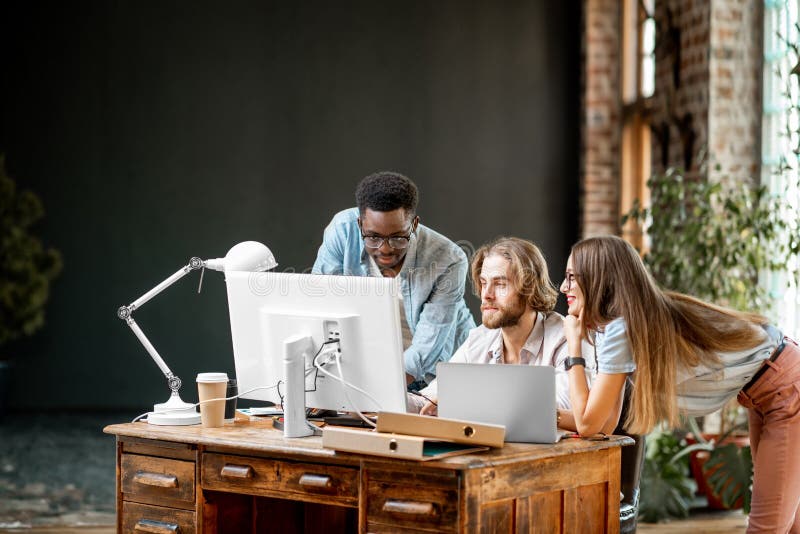 Young Coworkers Working with Computer Indoors Stock Photo - Image of ...