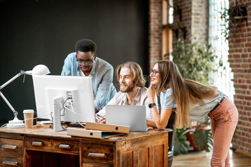 Young Coworkers Working with Computer Indoors Stock Photo - Image of ...
