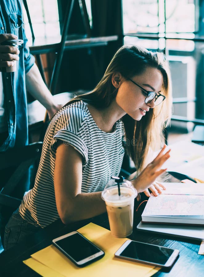 Young Coworking Students with Notepads in Cafe Stock Photo - Image of ...
