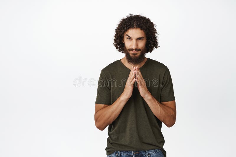 Young Man Evil Genius Smile, Looks Coy and Steeple Fingers, Has ...