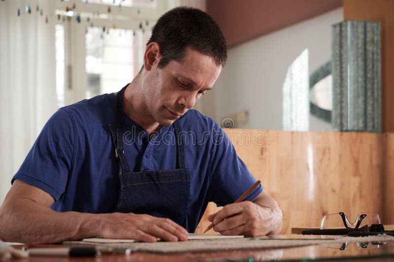 Young Craftsman Drawing Sketches in Notepad Stock Photo - Image of ...