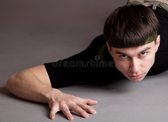 Young crawling man stock image. Image of army, dark, clothing - 11594913