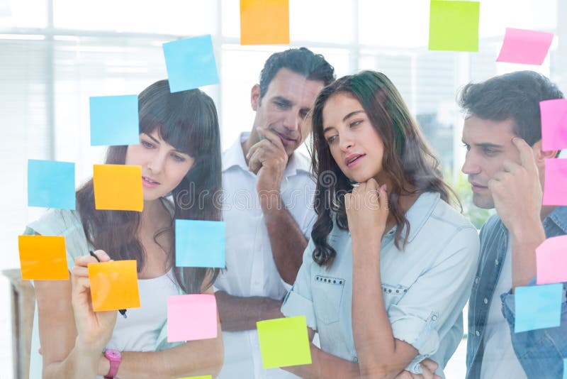 Young Creative Business People Looking at Photo Editor Stock Photo ...