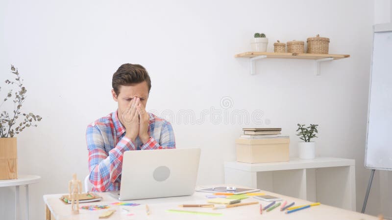 Young Creative Designer Man with Headache Working at His Creative ...