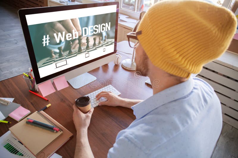 Young Creative Manager Sitting at His Table and Working on Computer ...