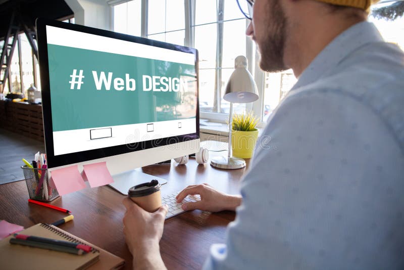 Young Creative Manager Sitting at His Table and Working on Computer ...