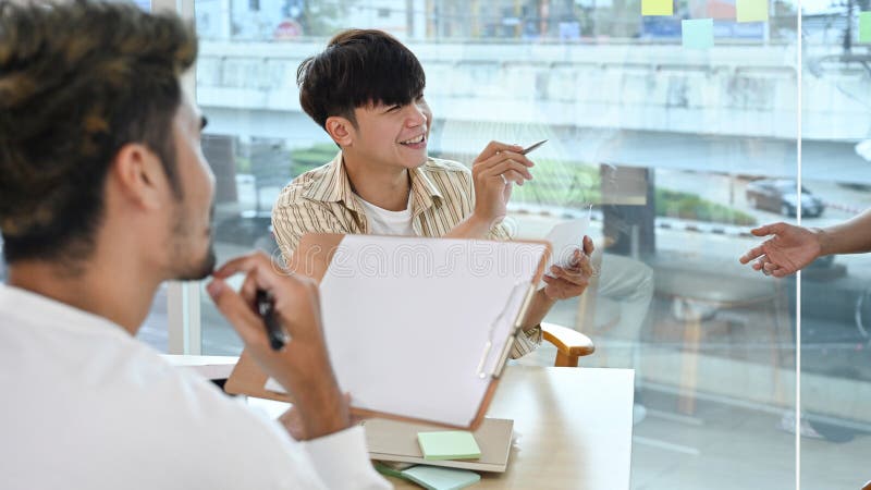 Young Creative People Sharing Ideas, Discussing Discussing Information ...