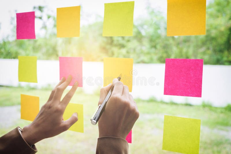 Young Creative Professional Leader Using Post it Notes in Glass Stock ...