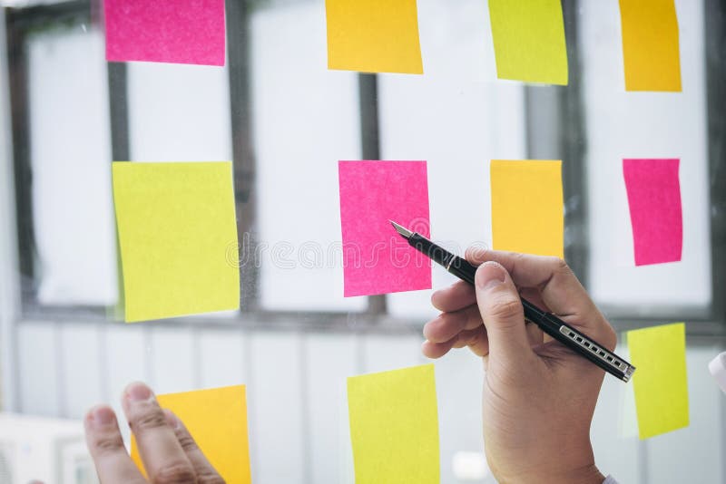 Young Creative Professional Leader Using Post it Notes in Glass Stock ...
