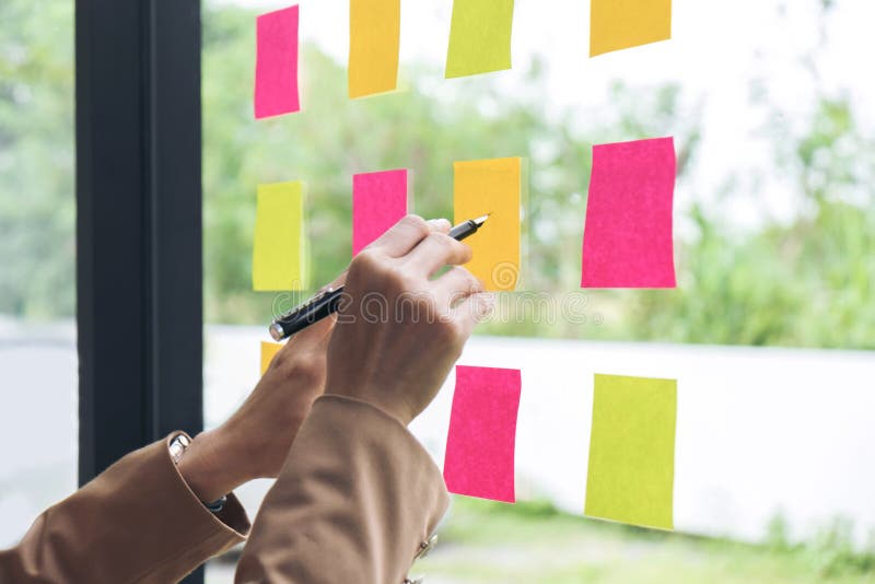 Young Creative Professional Leader Using Post it Notes in Glass Stock ...