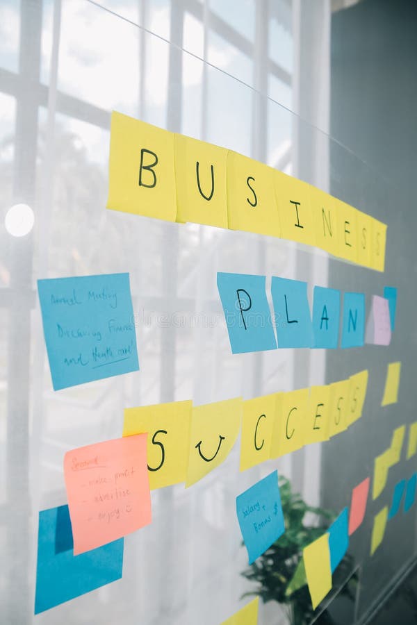 Young Creative Team Professional Using Post it Notes in Glass Wall To ...