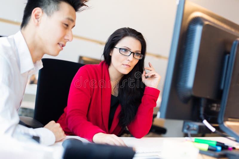 Young Creative Team Working on Their Computer Stock Image - Image of ...