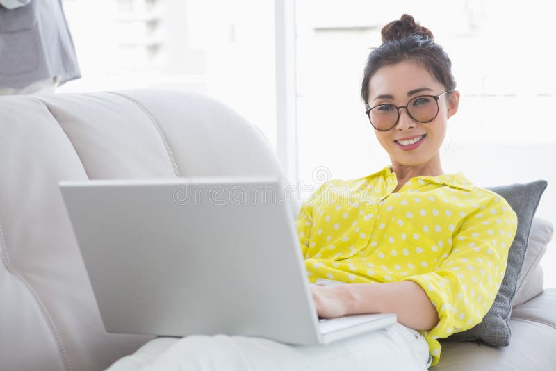 Young Creative Woman Using Laptop on Couch Stock Photo - Image of young ...