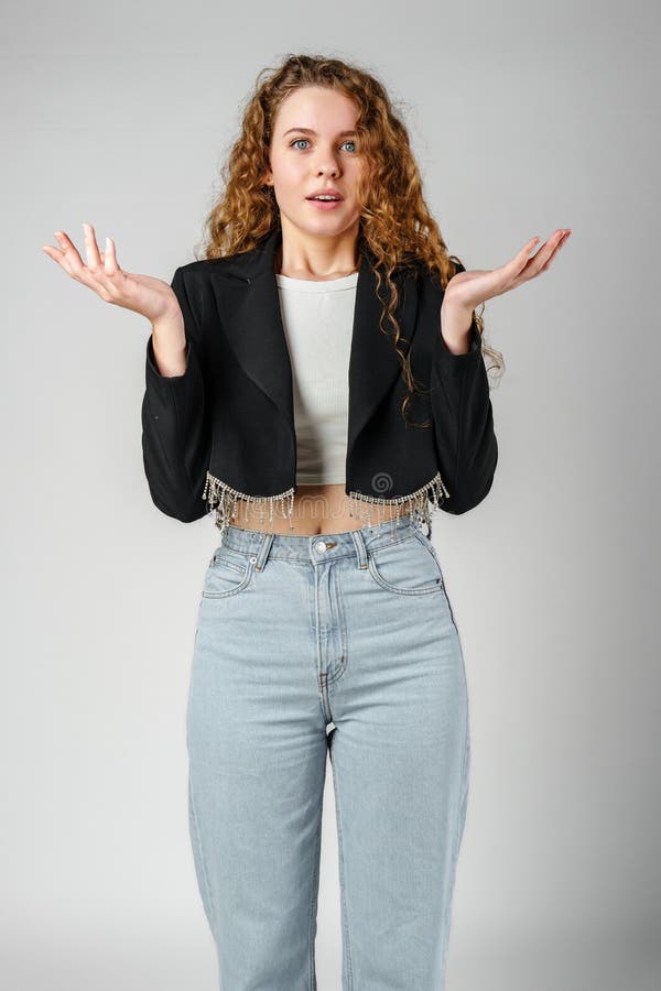 Young Curly Clueless Woman Holding Out Hands Stock Image - Image of ...