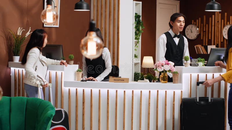 Young Customer Approaching Front Desk in Hotel Lobby Stock Footage ...