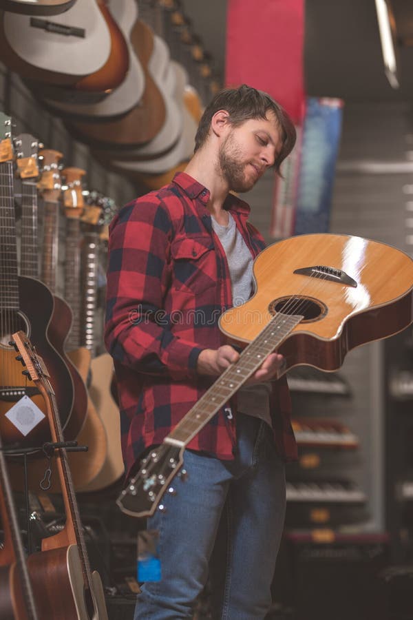 Young Customer in a Music Store Stock Photo - Image of sound, owner ...