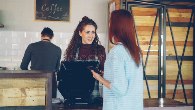 Young Customer Purchasing Takeout Coffee in Modern Coffee Shop. Stock ...