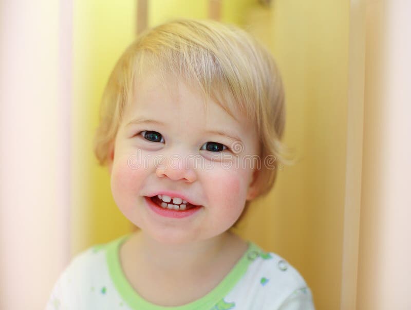Young cute child in crib stock image. Image of blond - 50707877