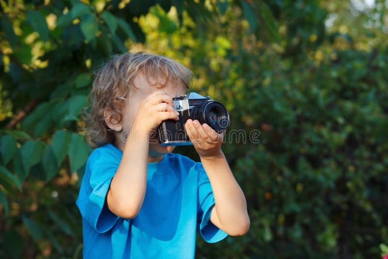 Young Cute Photographer with a Camera Outdoors Stock Photo - Image of ...