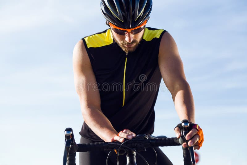 Young Cyclist Man Setting Timer on Bicycle in Sports Gear. Stock Image ...