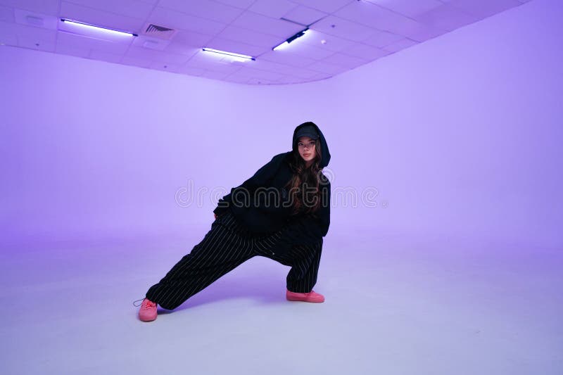 Young Dancer Performs a Dynamic Pose in Creative Studio Setting Stock ...