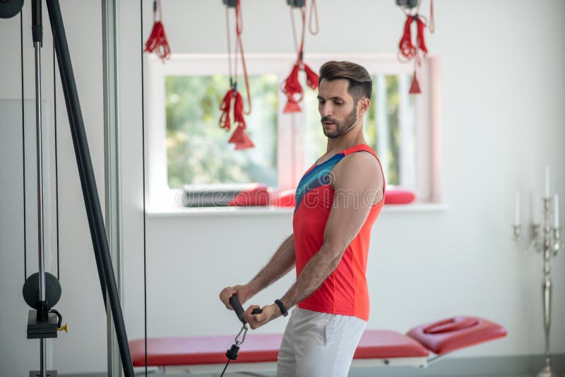 Young Dark-haired Man Pulling the Ropes and Looking Determined Stock ...