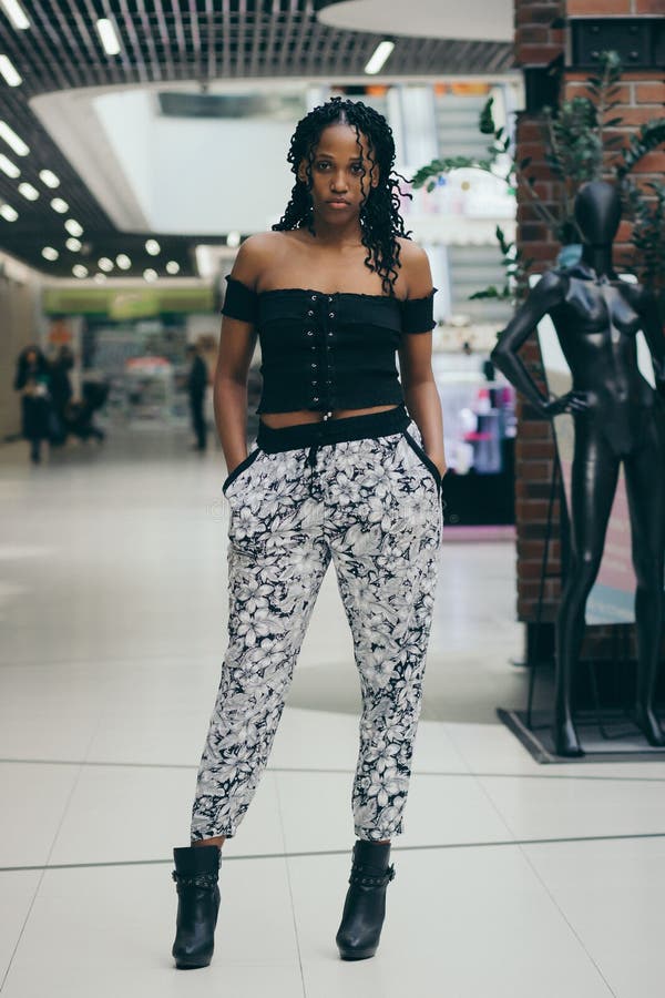 Young Dark Skinned Woman Dressed In Casual Clothes Holding Cup Of Hot