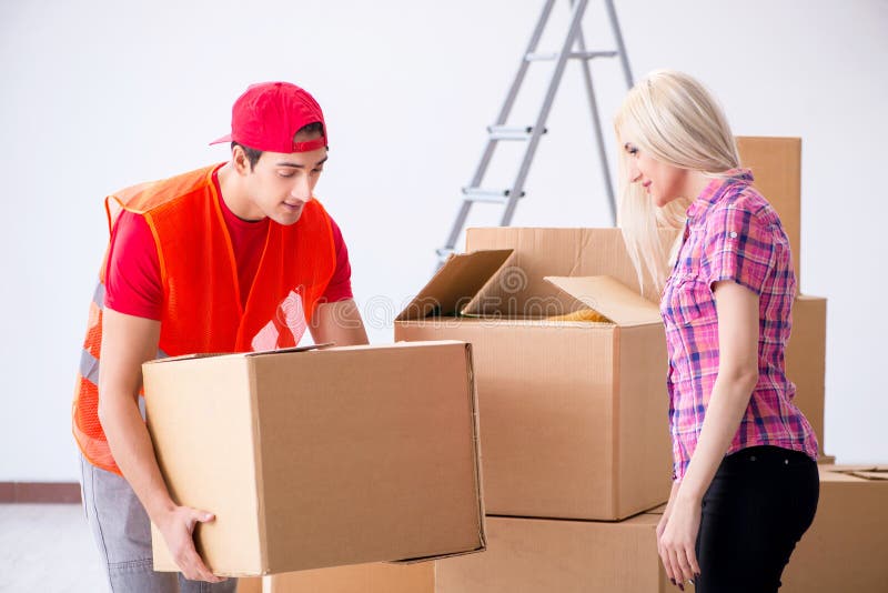 The Young Delivery Assistant Delivering To Home Stock Photo - Image of ...