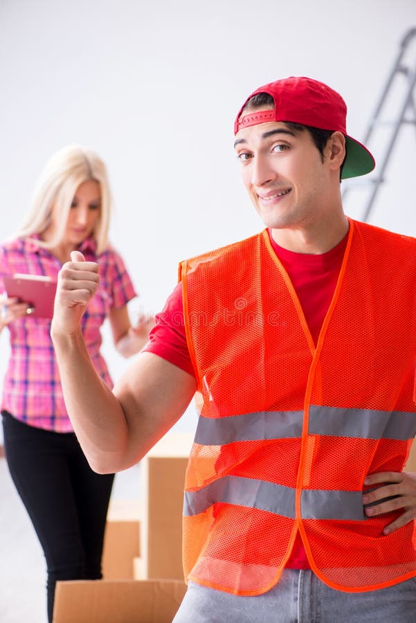 The Young Delivery Assistant Delivering To Home Stock Photo - Image of ...
