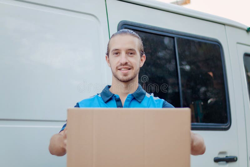 Young Delivery Boy Holding Box Stock Photo - Image of package, person ...