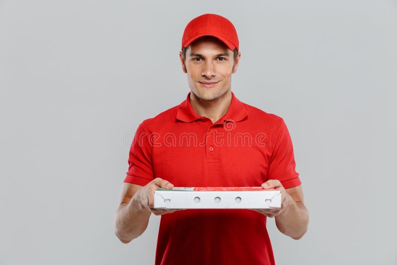 Young Delivery Man in Hat Smiling while Posing with Pizza Box Stock ...