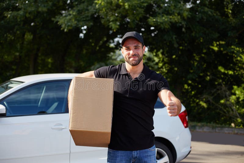 Smiling delivery man stock image. Image of mail, male - 45052839
