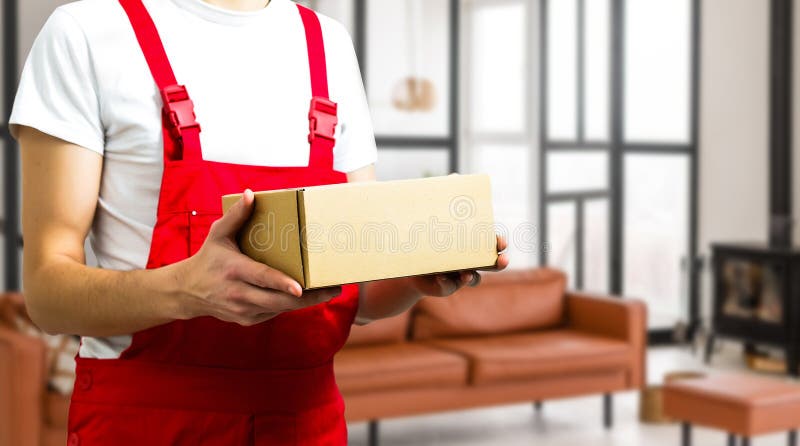 Young Delivery Man Standing with Parcel Post Box Stock Photo - Image of ...