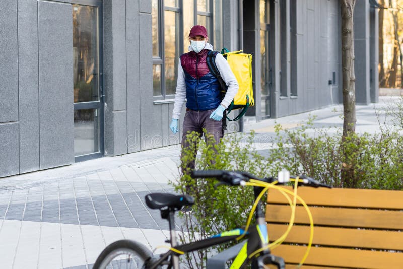 Young Delivery Man with Yellow Backpack Takeaway Concept Stock Photo ...