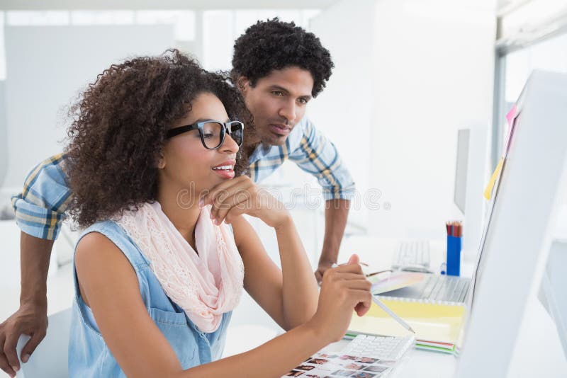 Young Design Team Working Together at Desk Stock Image - Image of ...